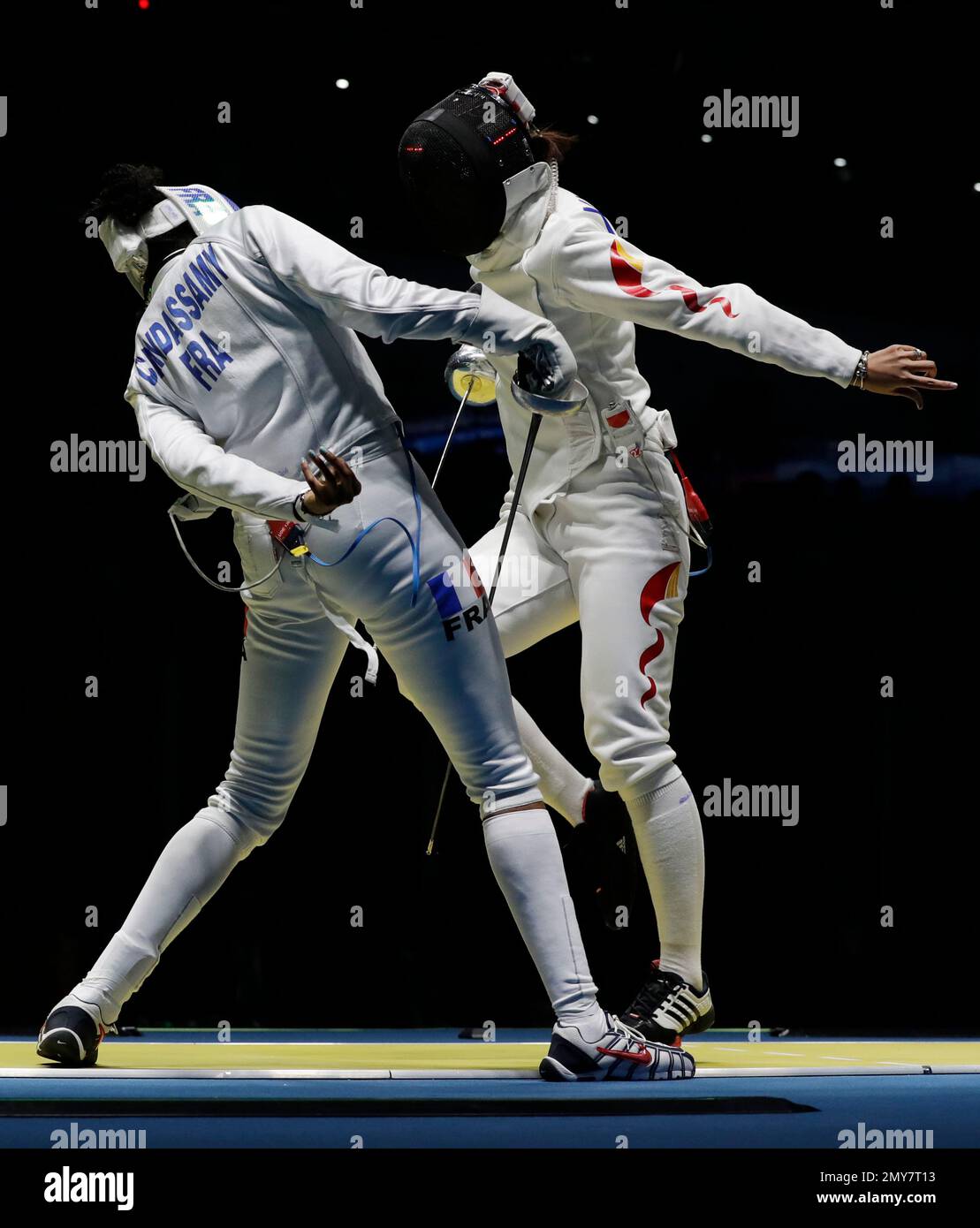 Xu Anqi of China, right, competes with Marie-Florence Candassamy of ...