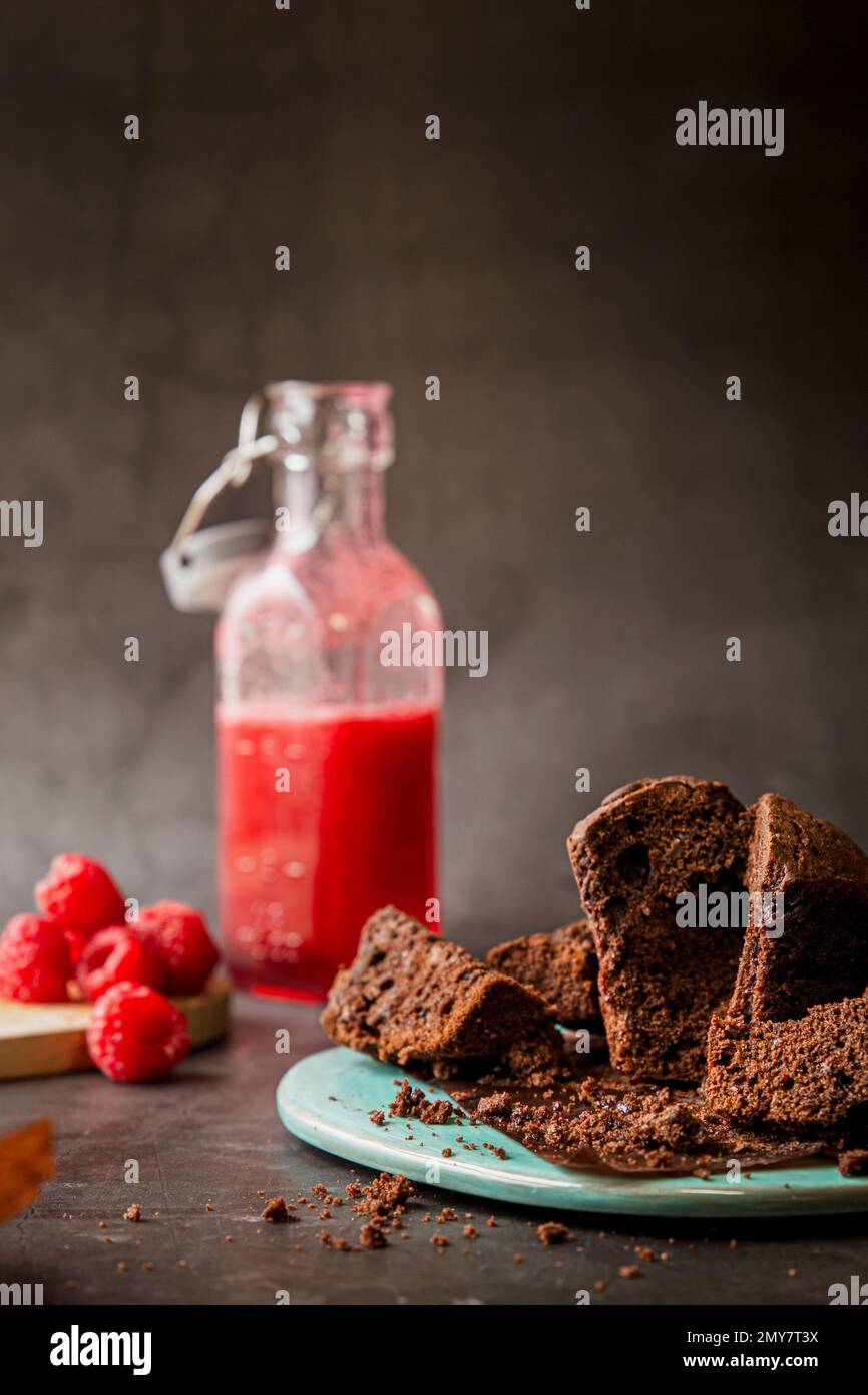 Chocolate Muffin open to be filled with raspberry sirup Stock Photo - Alamy