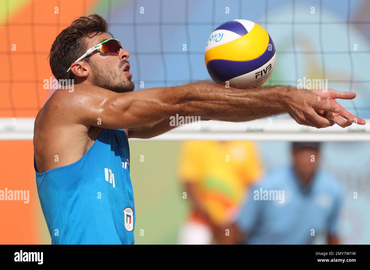 Italy's Alex Ranghieri sets a ball during a men's beach volleyball ...