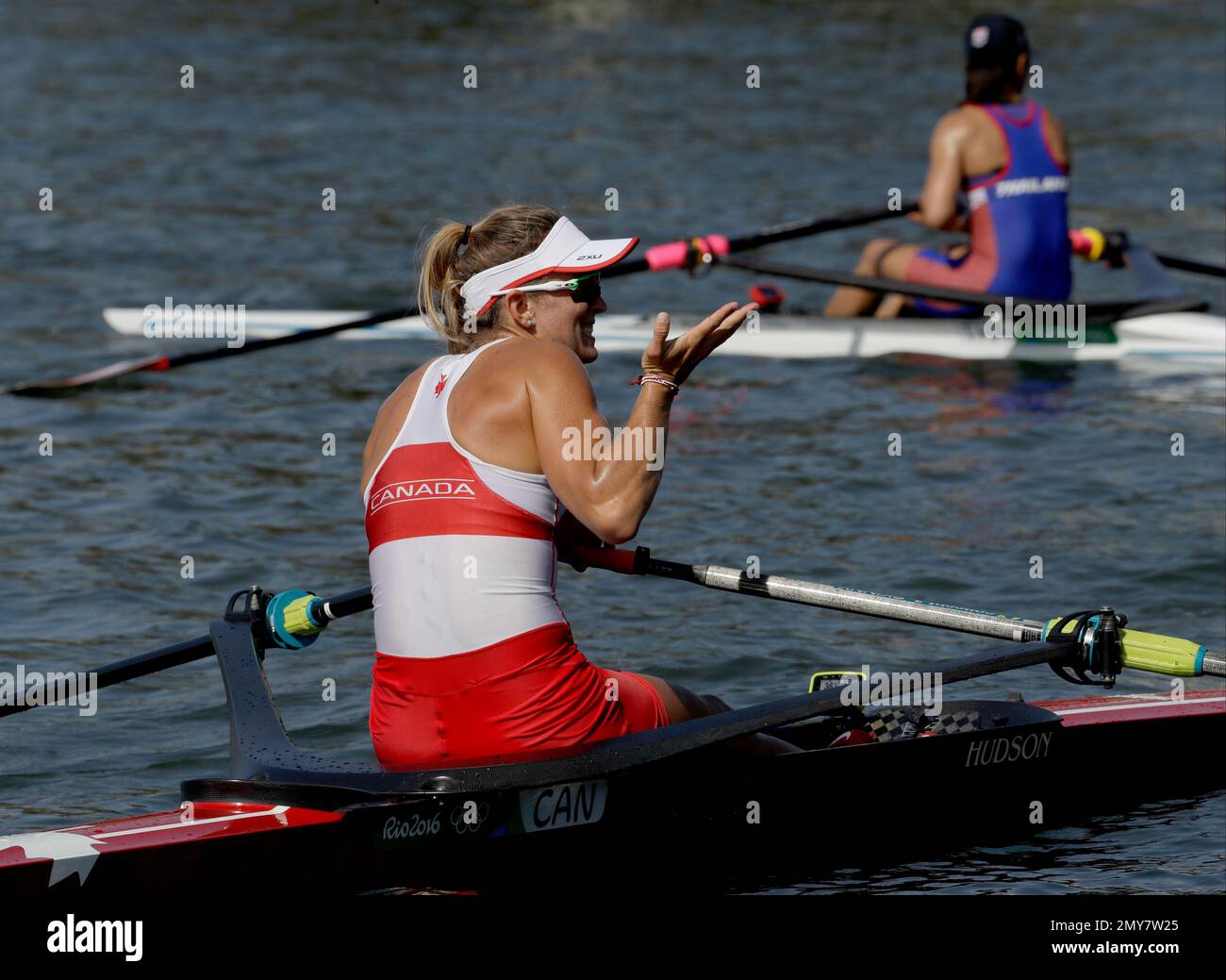 Carling Zeeman, of Canada, reacts to her coach after competing in the ...