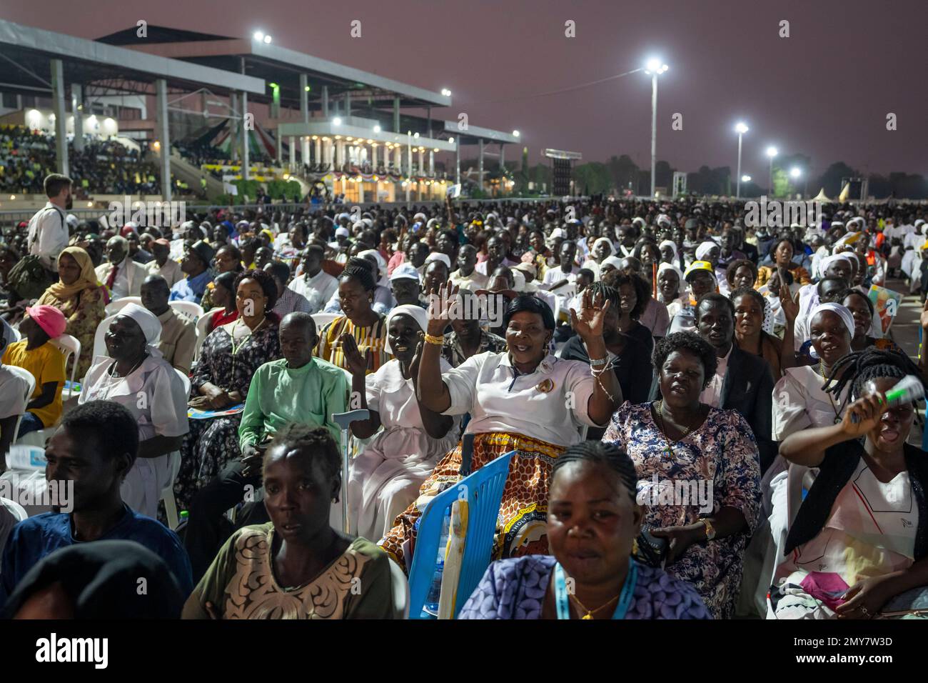 People sing as Pope Francis conducts an ecumenical prayer at the John ...