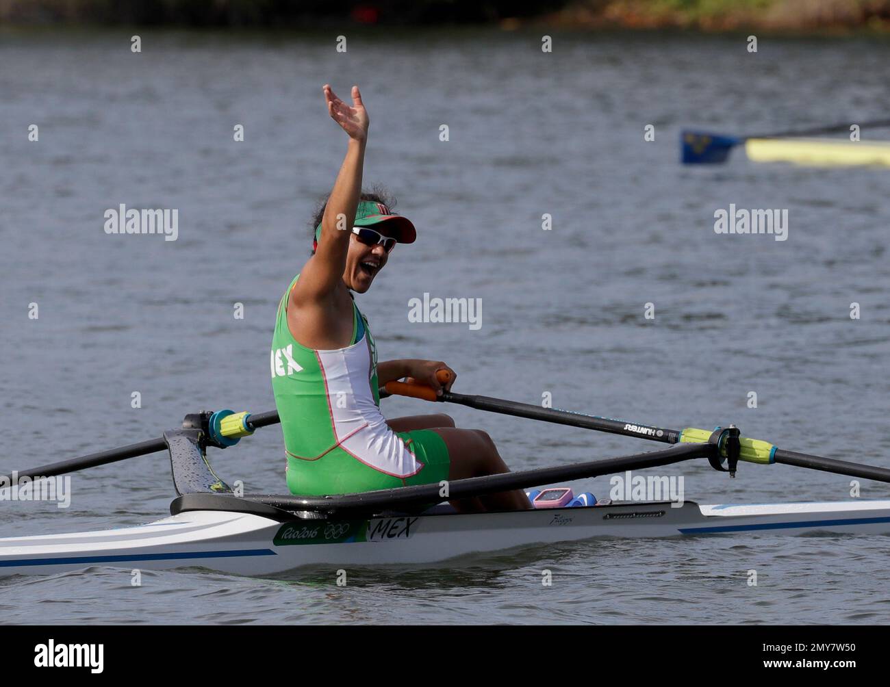 Kenia Lechuga Alanis, of Mexico, waves after competing in the women's ...