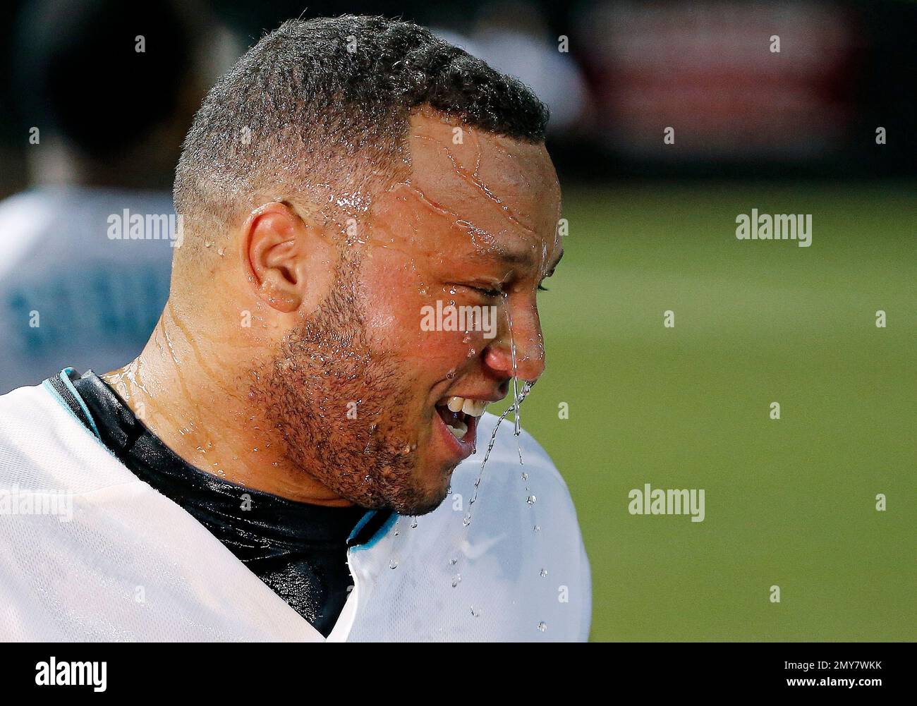 Arizona Diamondbacks' Welington Castillo smiles as he drips with water ...