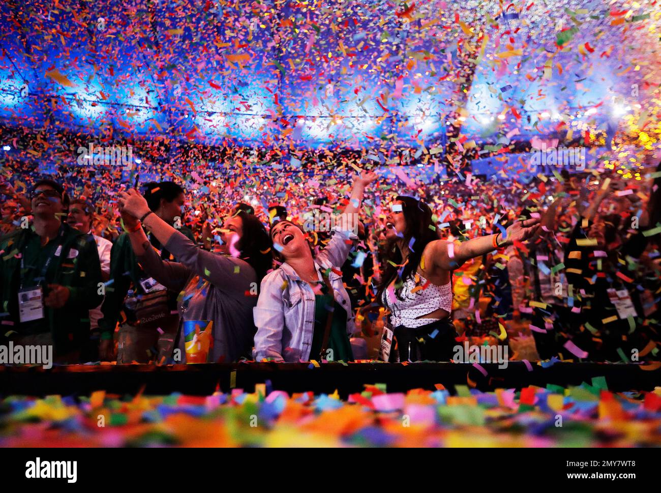 Spectators celebrate during the opening ceremony for the 2016 Summer ...