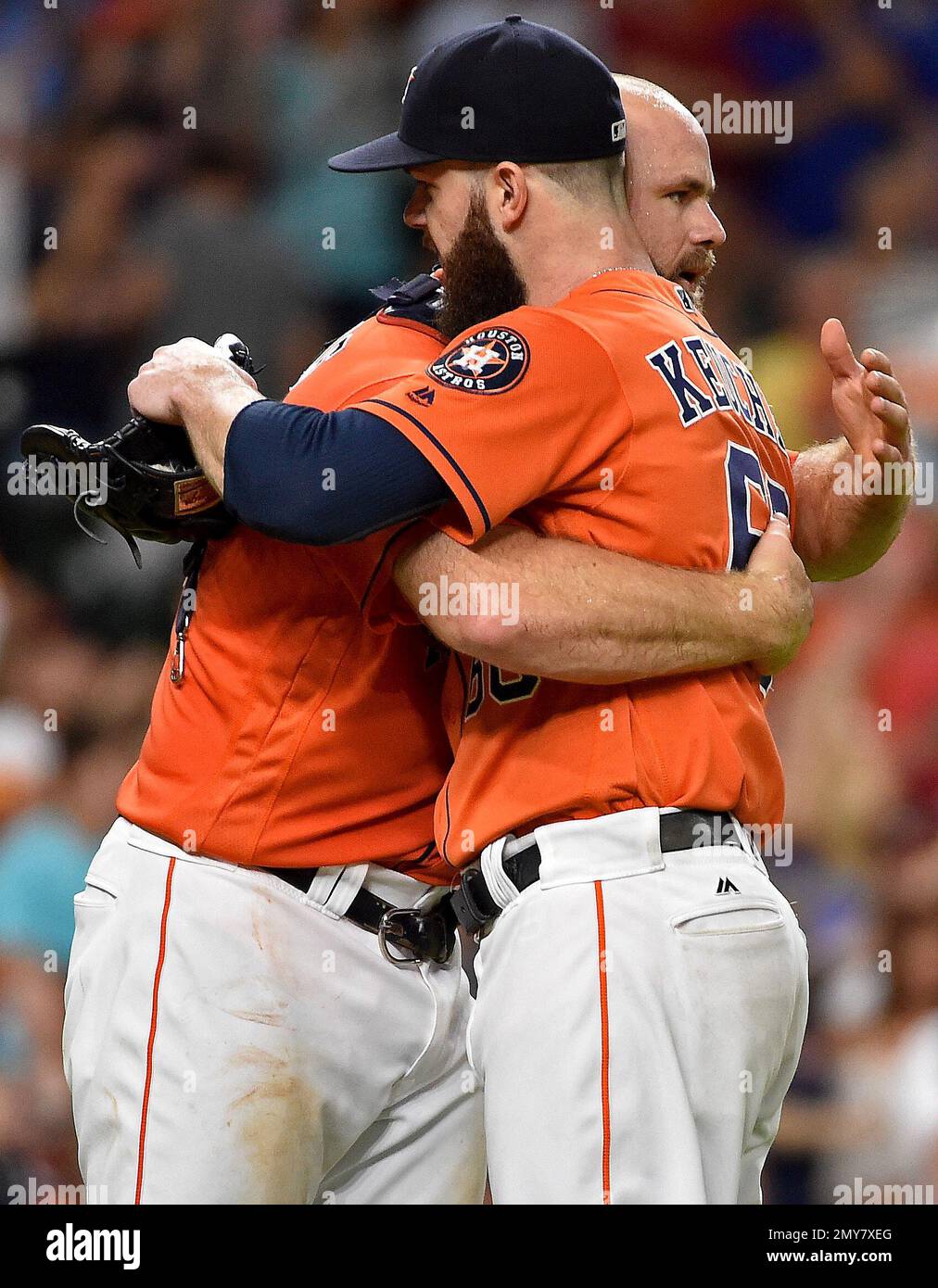 Houston Astros starting pitcher Dallas Keuchel, right, hugs catcher ...