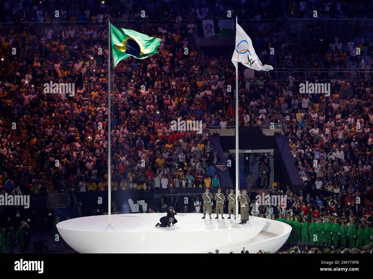 Soldiers hoist the Olympic flag during the opening ceremony for the ...