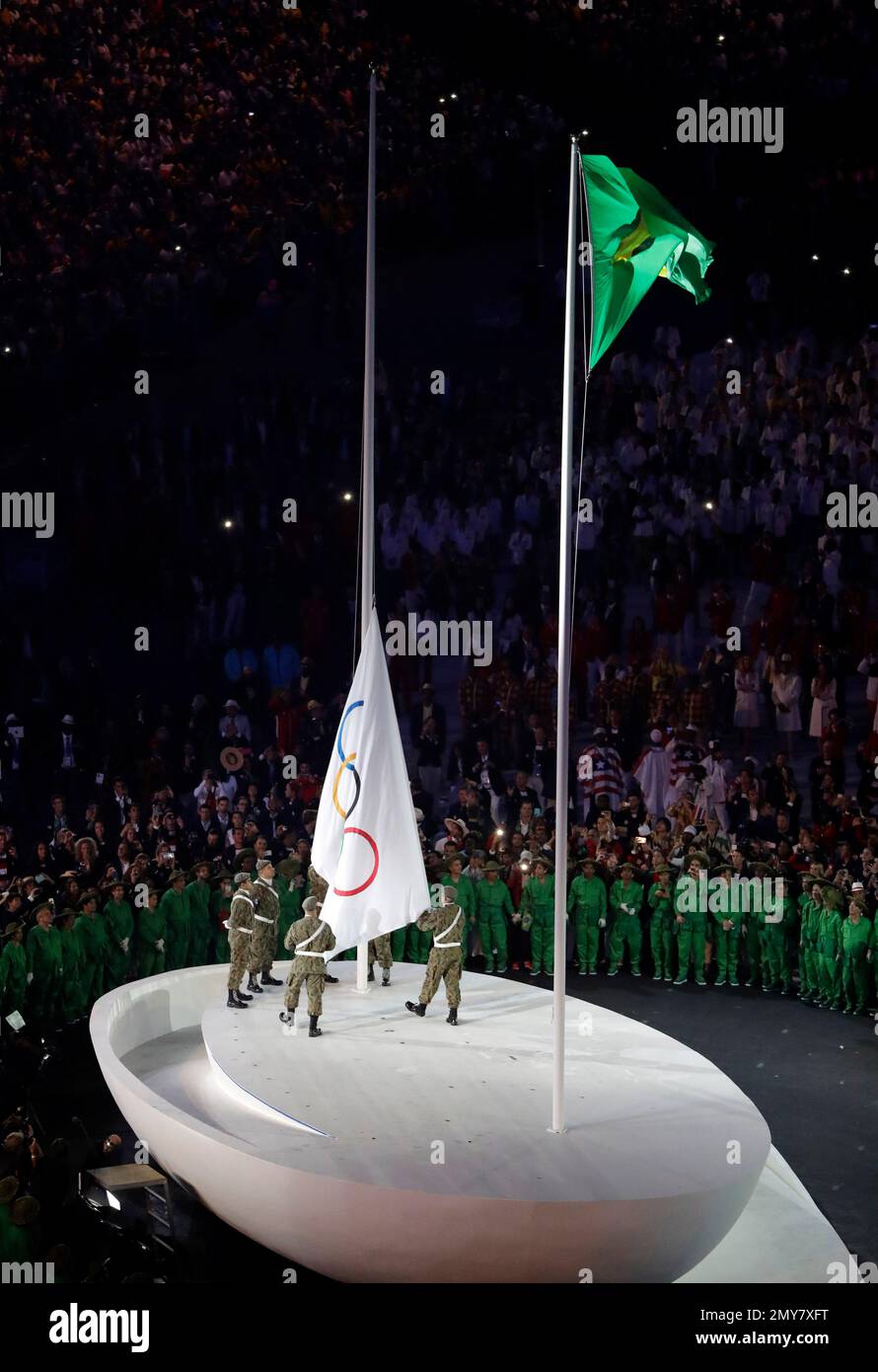 The Olympic flag is raised during the opening ceremony for the 2016 ...
