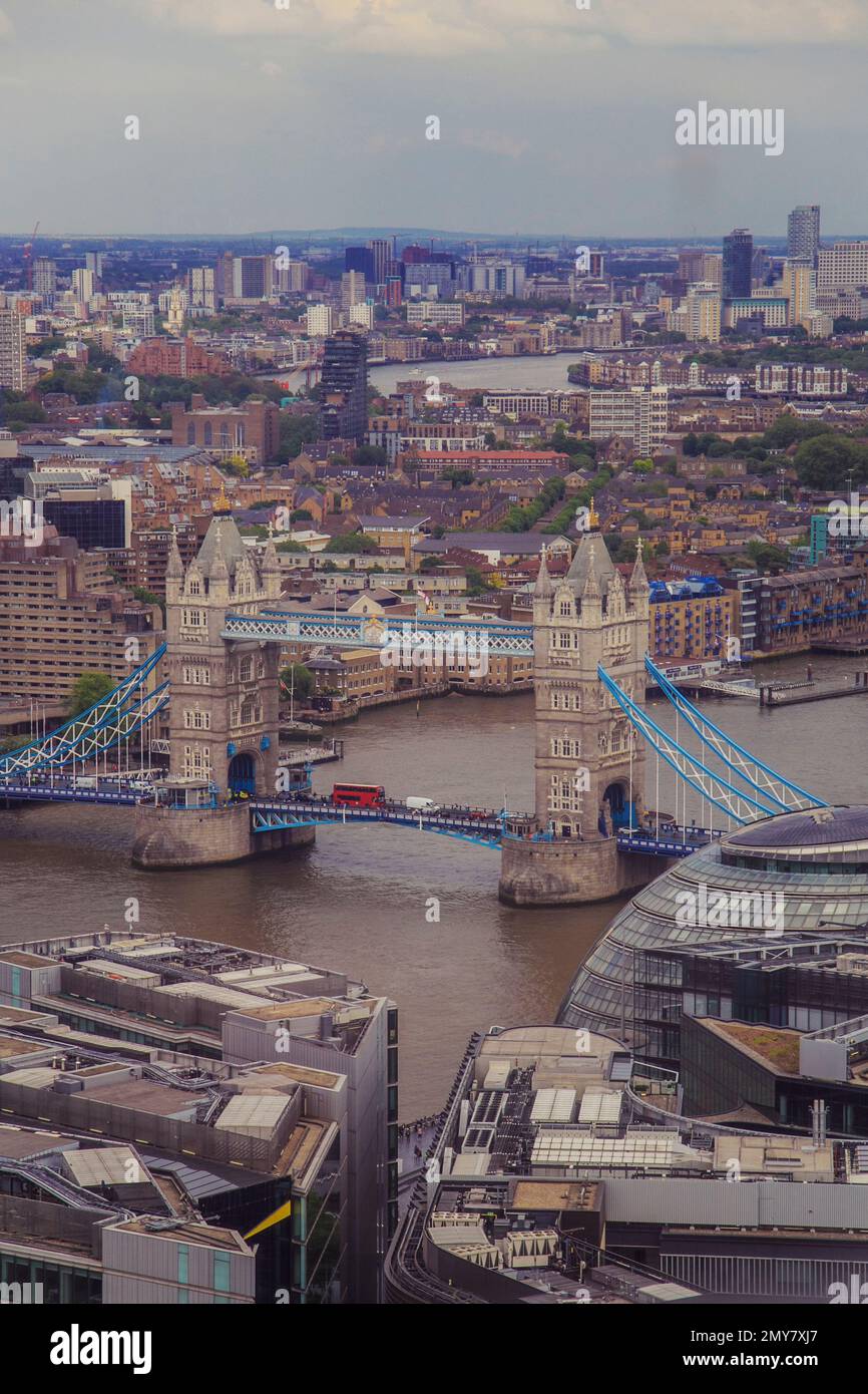 Iconic Red Bus Crossing Tower Bridge in London Stock Photo - Alamy