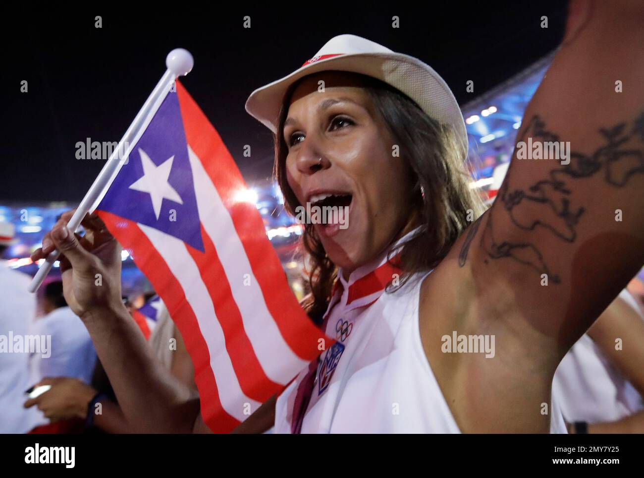 A member of team Puerto Rico walks in the arena during the opening ...