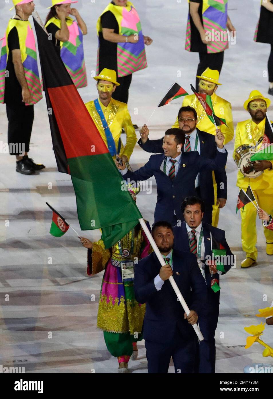 Mohammad Tawfiq Bakhshi carries the flag of Afghanistan during the ...