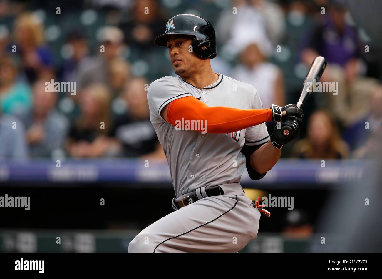 Miami Marlins' Giancarlo Stanton follows the flight of his RBI-double ...