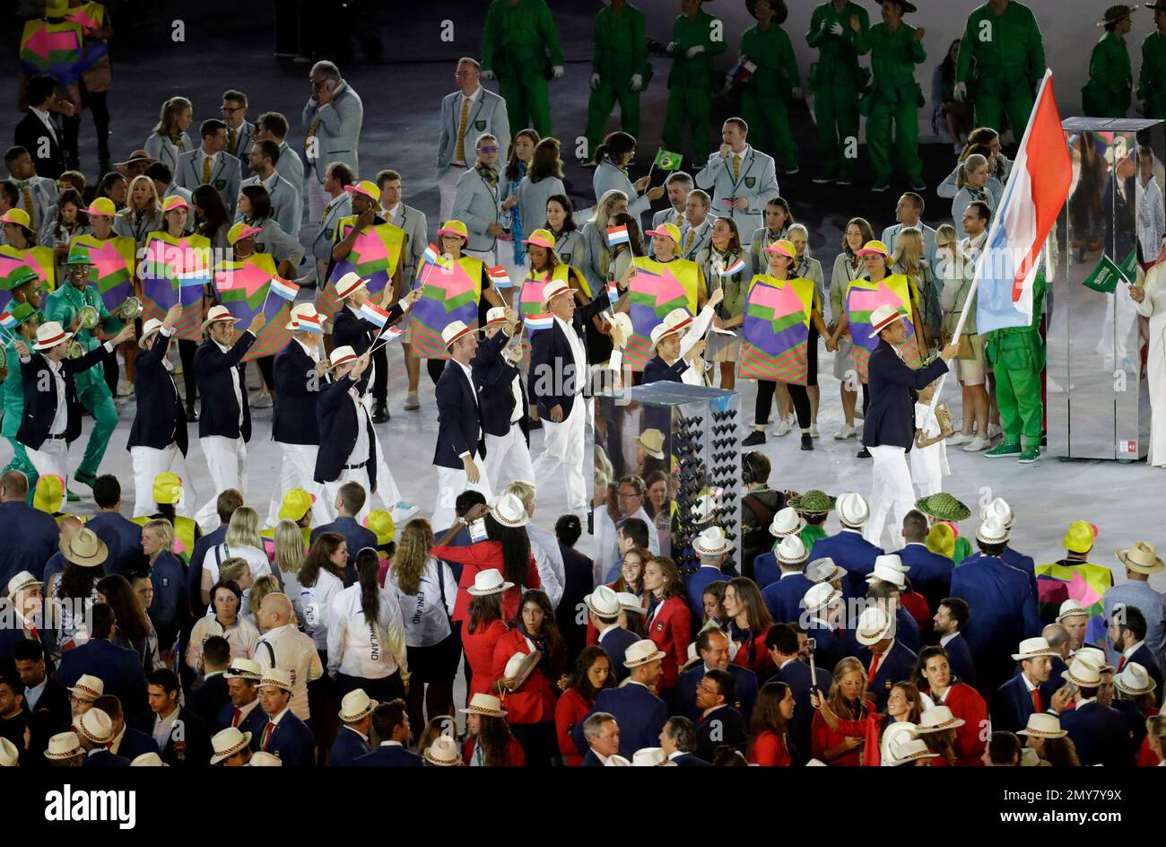 Gilles Muller carries the flag of Luxembourg during the opening ...