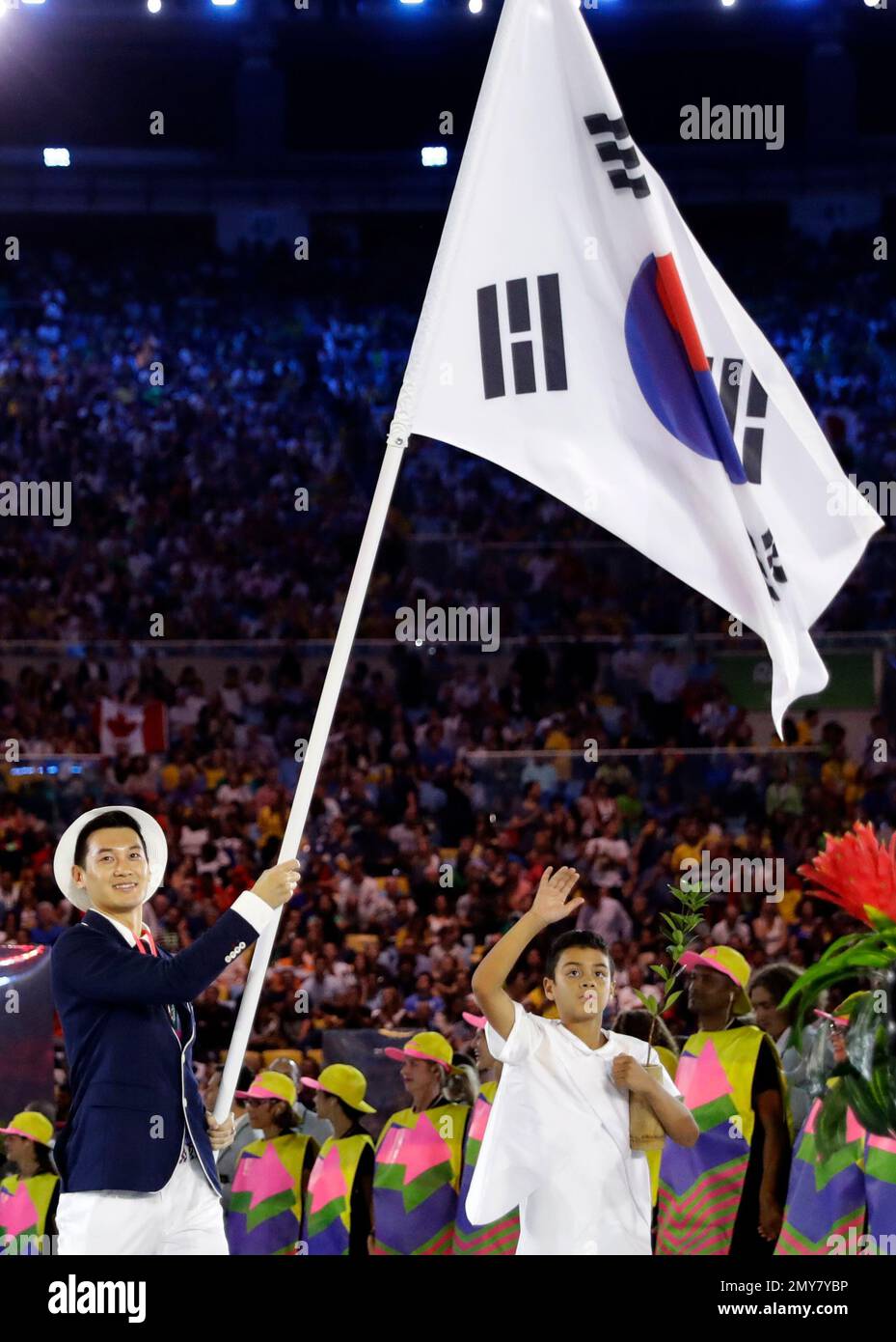 Gu Bon-gil carries the flag of South Korea during the opening ceremony ...