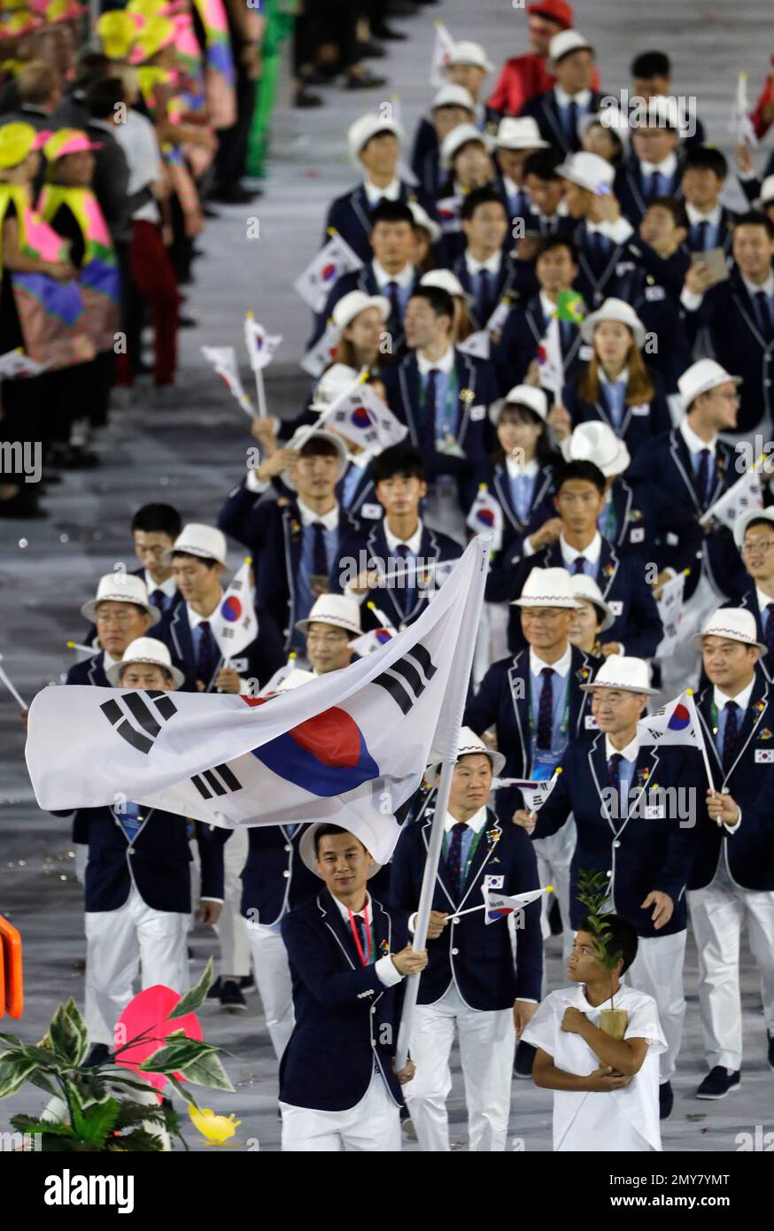 Gu Bon-gil carries the flag of South Korea during the opening ceremony ...