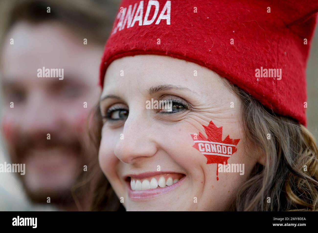 A fan from Canada poses for a picture as she walks towards the Maracana ...