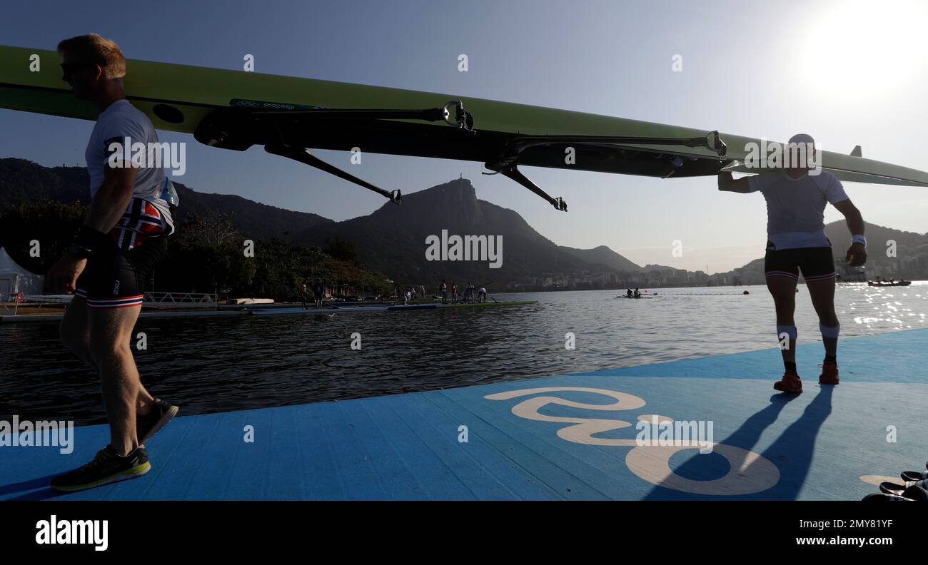 New Zealand double sculls rowing team hold the shell after practice in ...