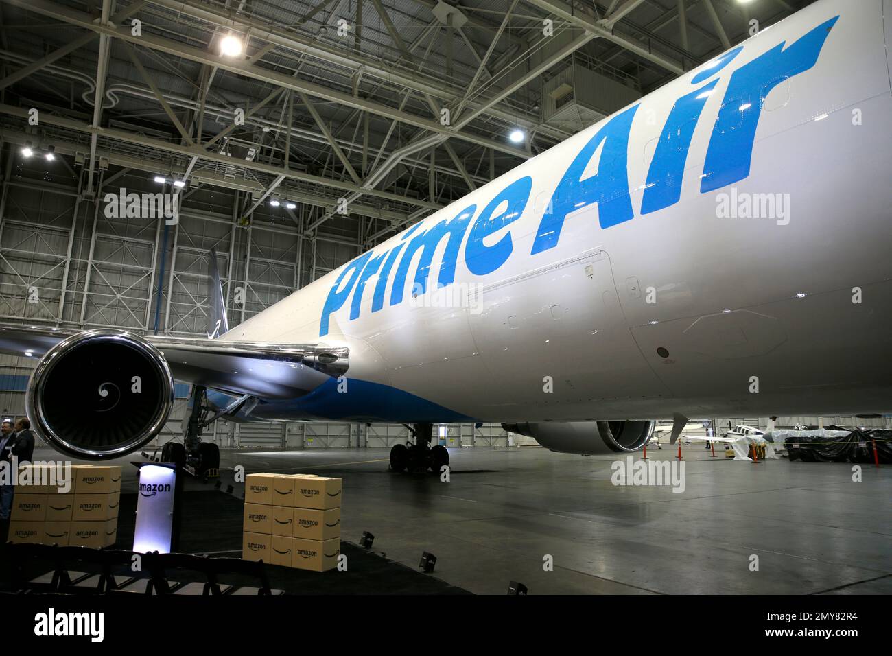 Amazon.com boxes are shown stacked near a Boeing 767, an Amazon "Prime ...