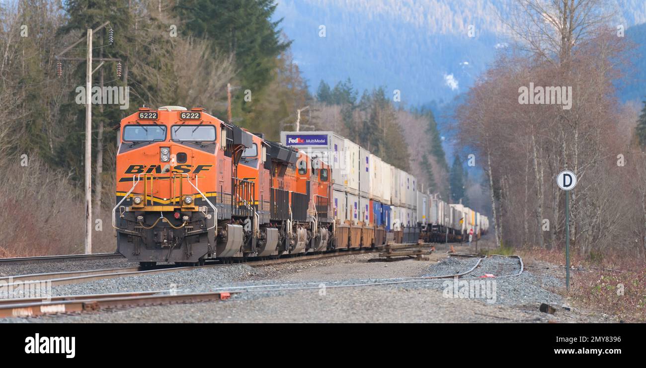 Baring, WA, USA - February 1, 2023; BNSF container freight train with ...