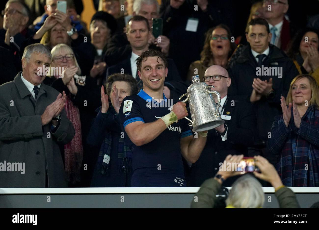 Scotland captain James Ritchie lifts the Calcutta Cup trophy received ...