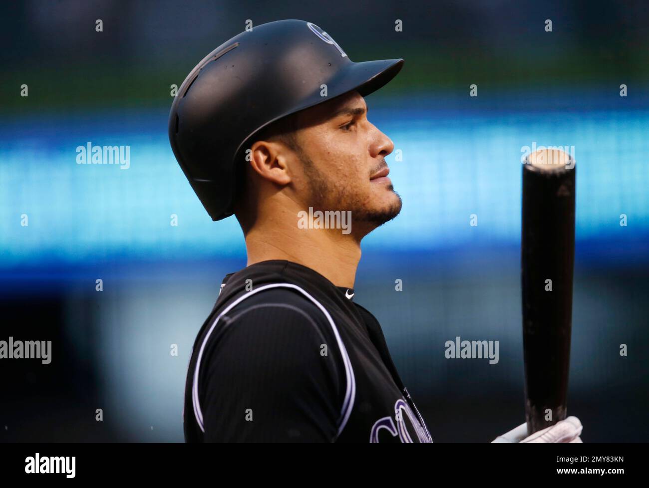 Colorado Rockies' Nolan Arenado reacts after swinging at and missing a ...