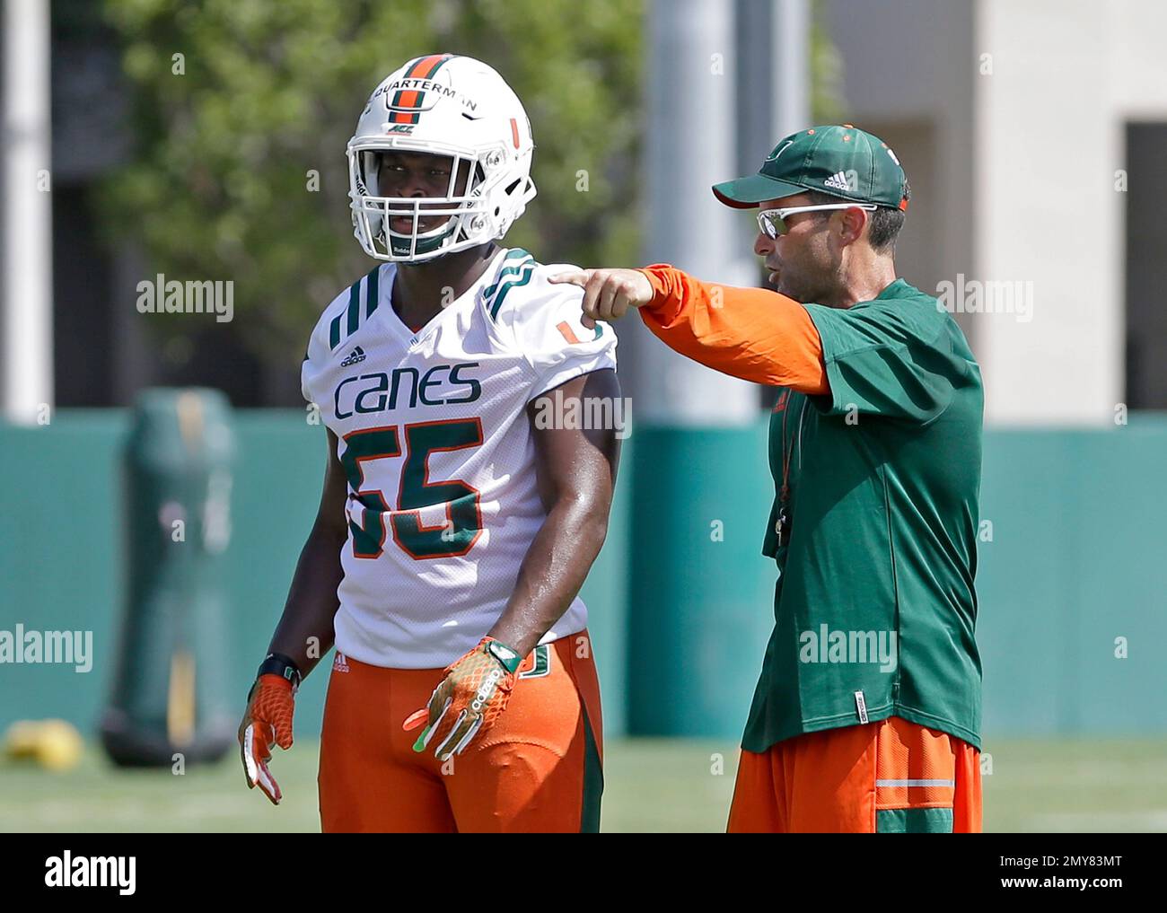 Miami defensive coordinator Manny Diaz, right, gives instructions to ...