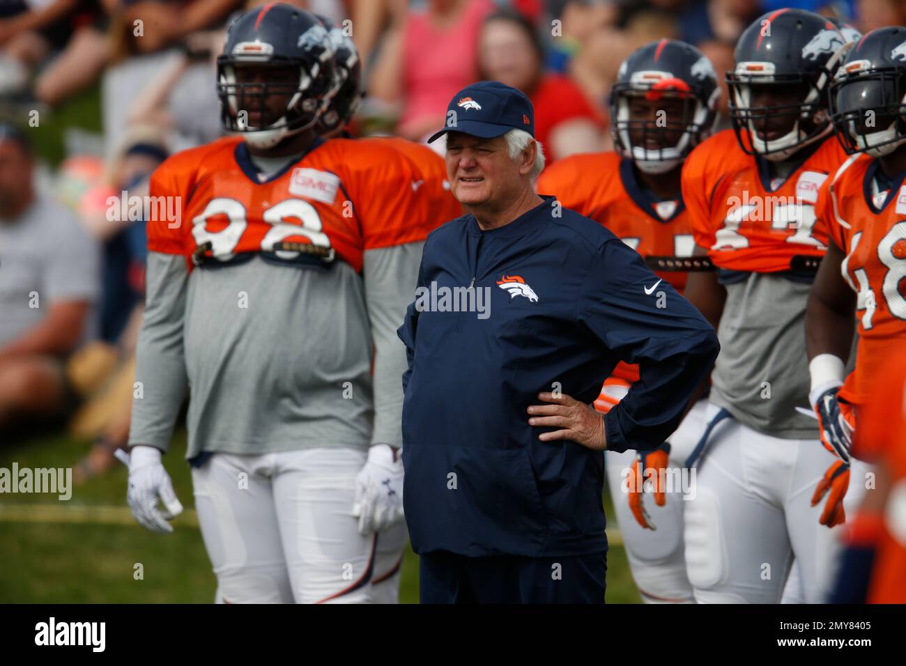 Denver Broncos defensive coordinator Wade Phillips takes part in drills ...