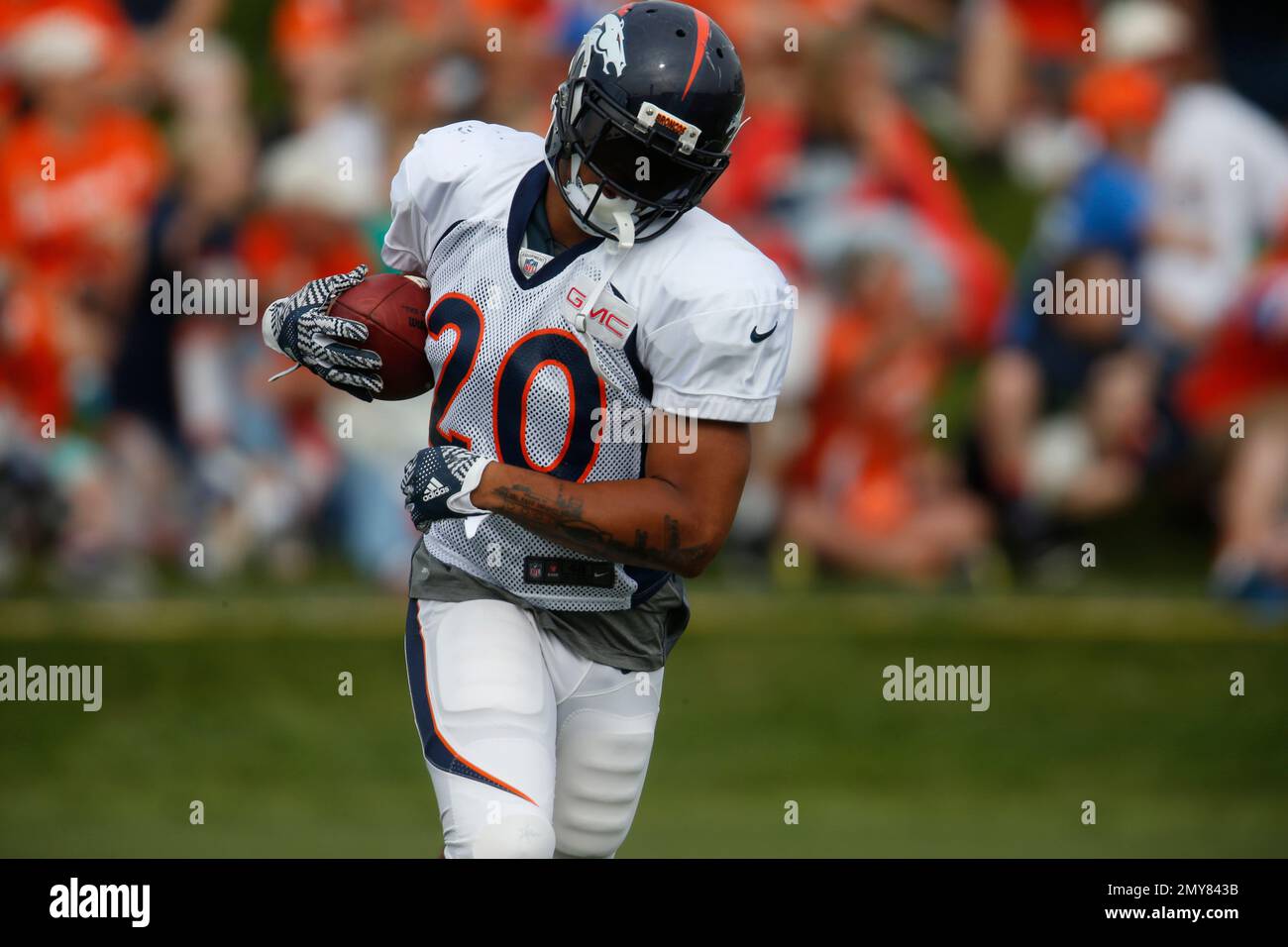 Denver Broncos running back Devontae Booker (20) takes part in drills during the team's NFL ...