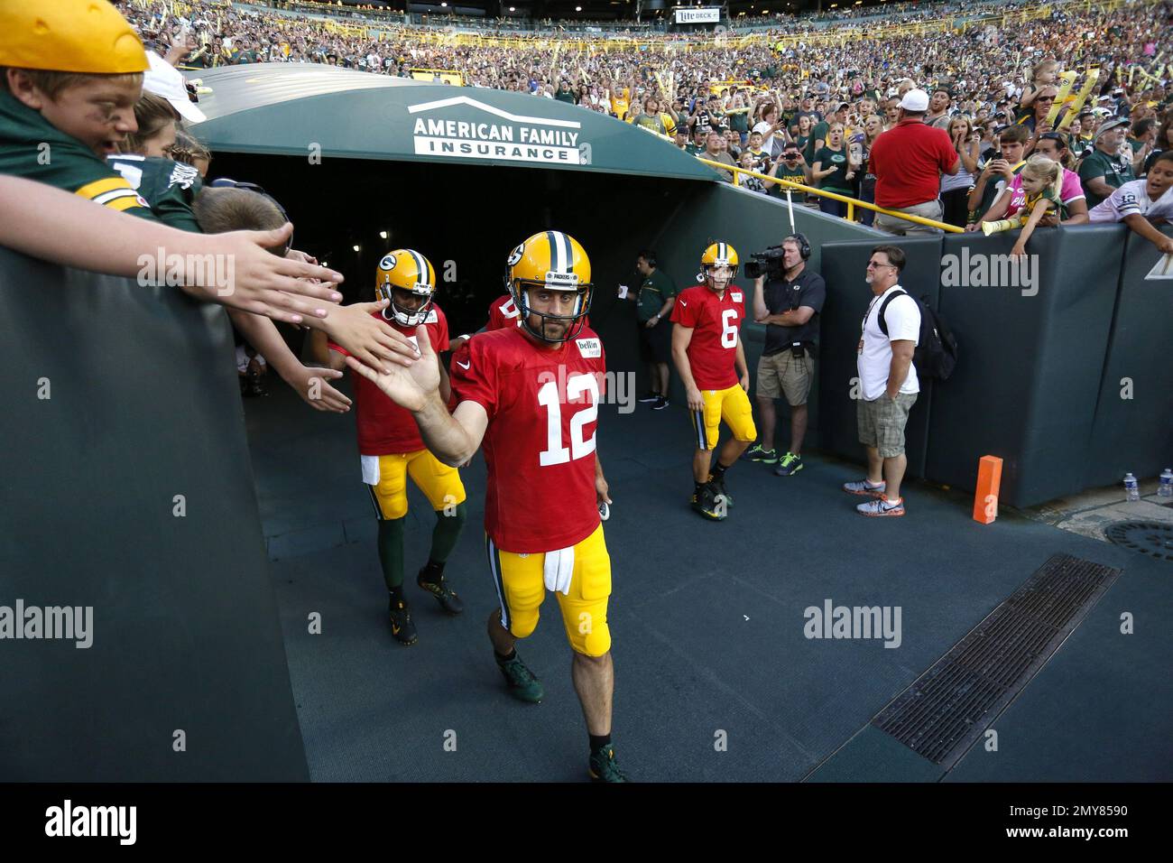 Green Bay Packers quarterback Aaron Rodgers (12), quarterback Marquise ... Green Bay Packers quarterback Aaron Rodgers (12), quarterback Marquise ...