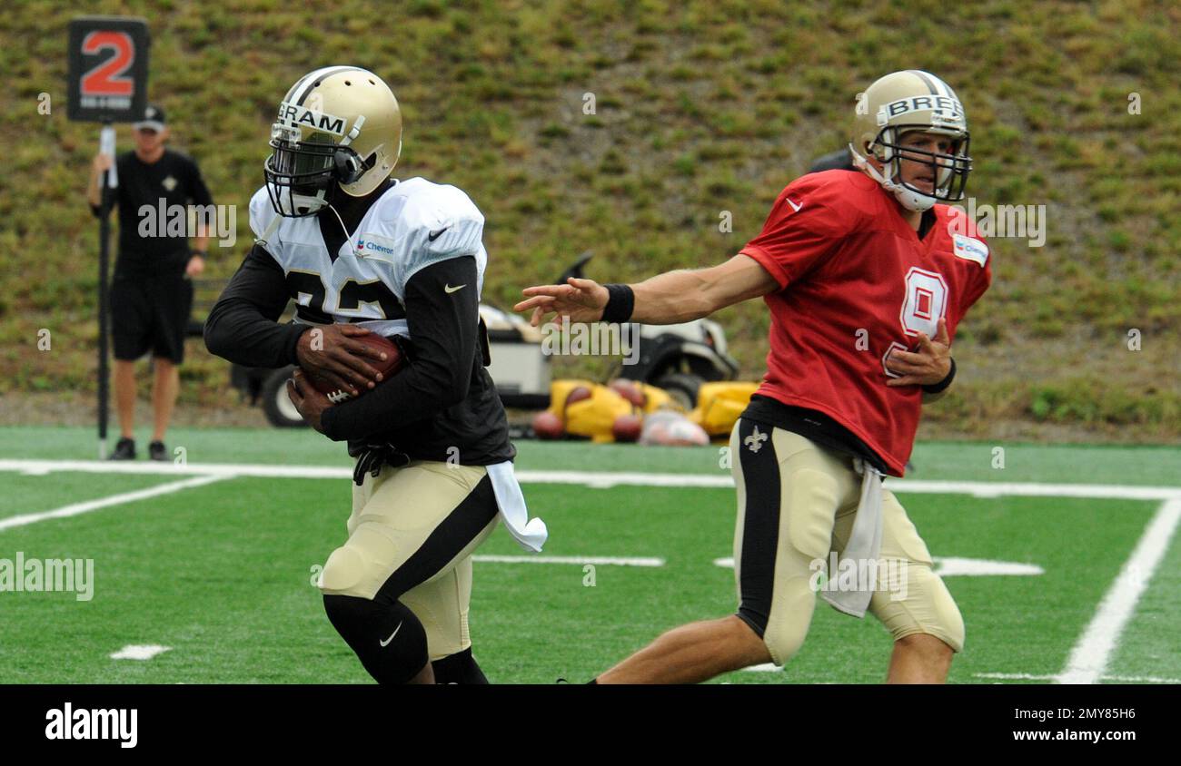 New Orleans Saints hands the ball off New Orleans Saints running back ...