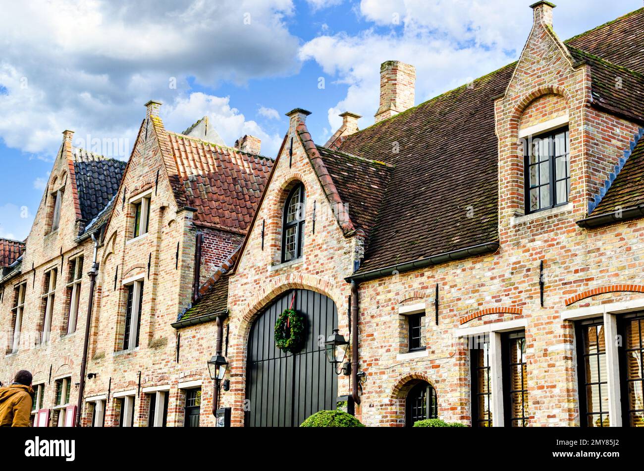 Bruges, Belgium; view of the medieval buildings that are crossed by the ...