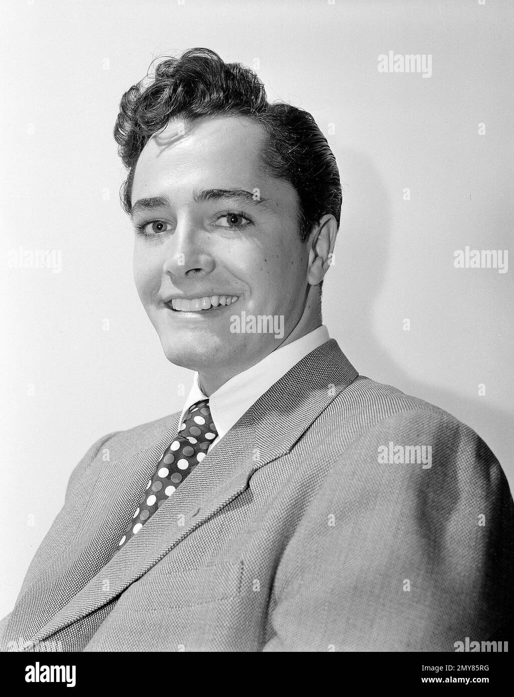 Actor John Derek, who believes one should marry young, is shown in New ...