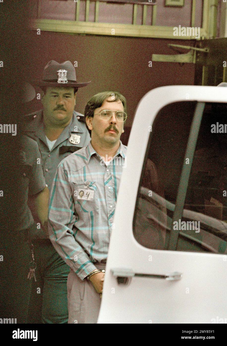Admitted serial killer Joel Rifkin is escorted from court in Mineola, N ...