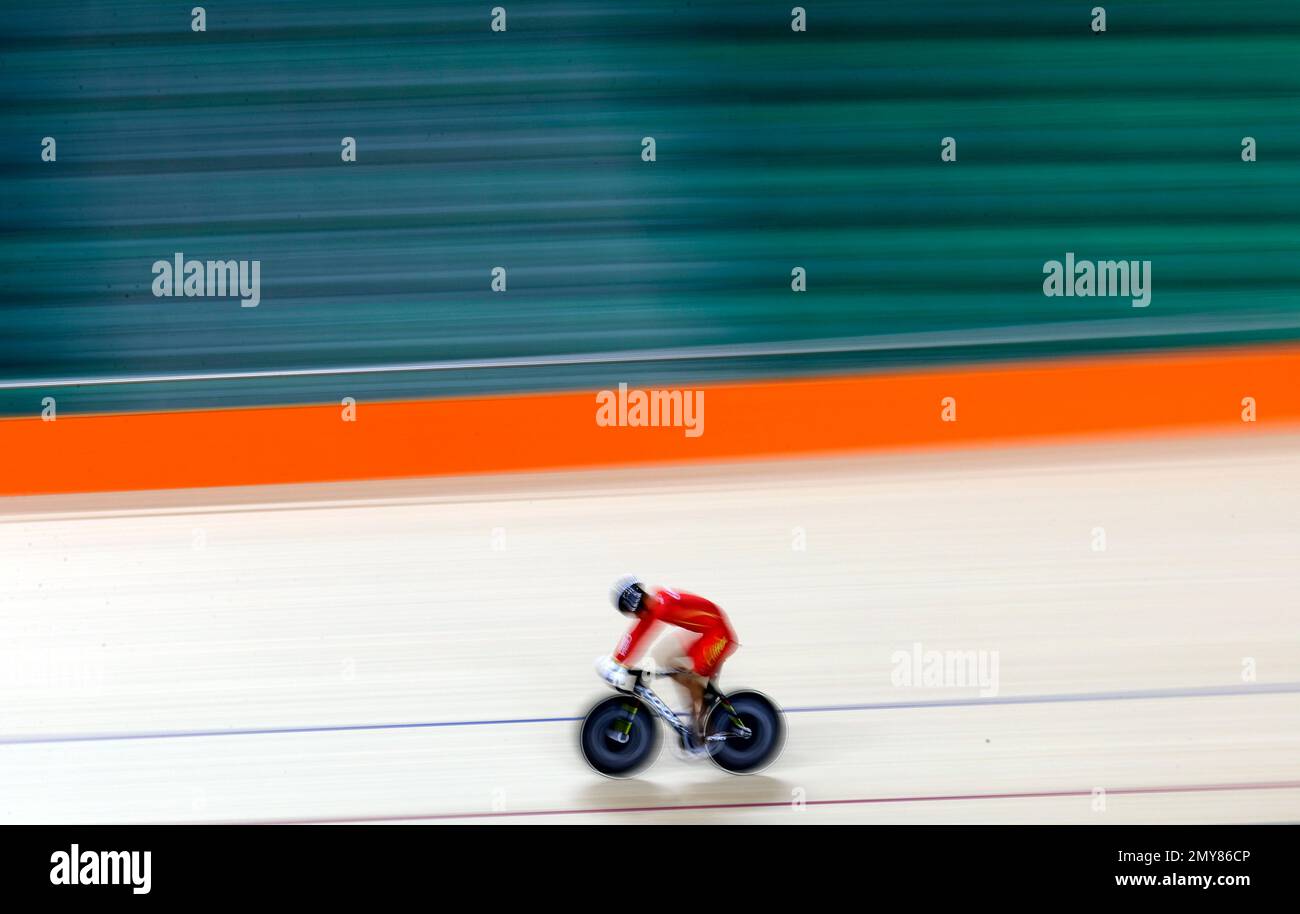 A member of the Chinese men's track cycling team rounds the track ...