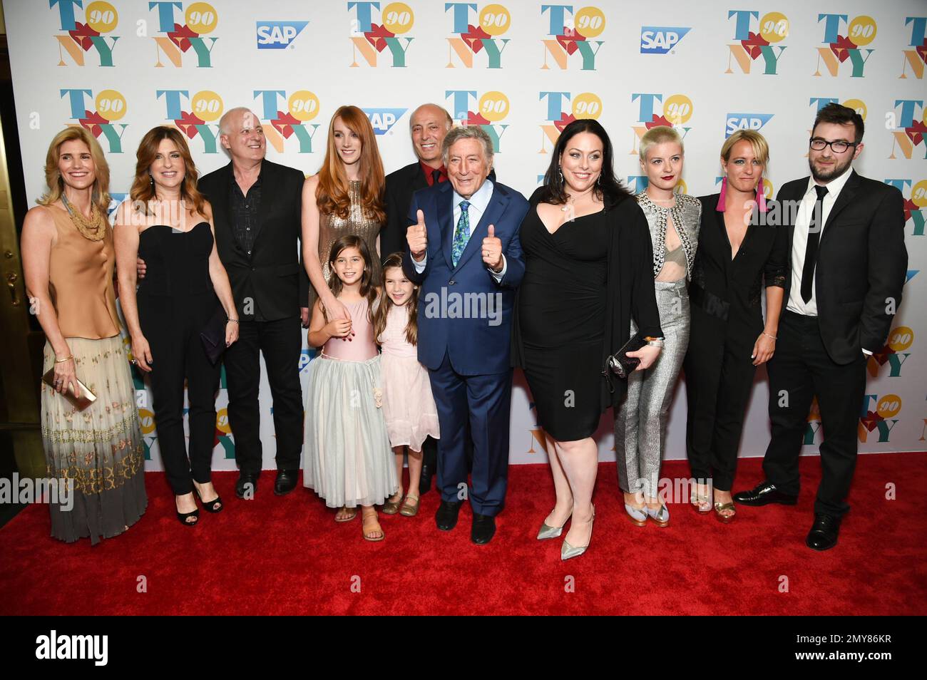 Singer Tony Bennett, center, poses with family members at his 90th ...