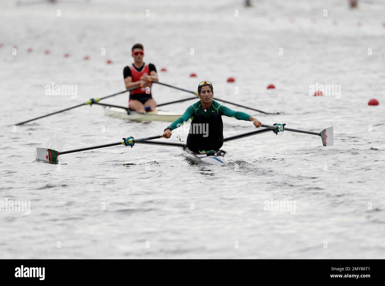 Algeria's women's single scull, front, and Switzerland men's single ...