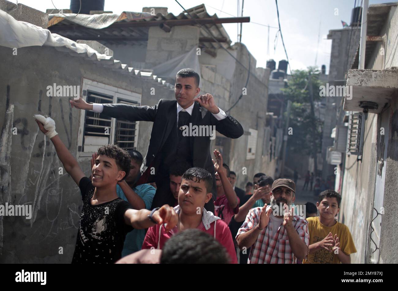 In this Saturday, July 30, 2016 photo, friends and relatives of ...