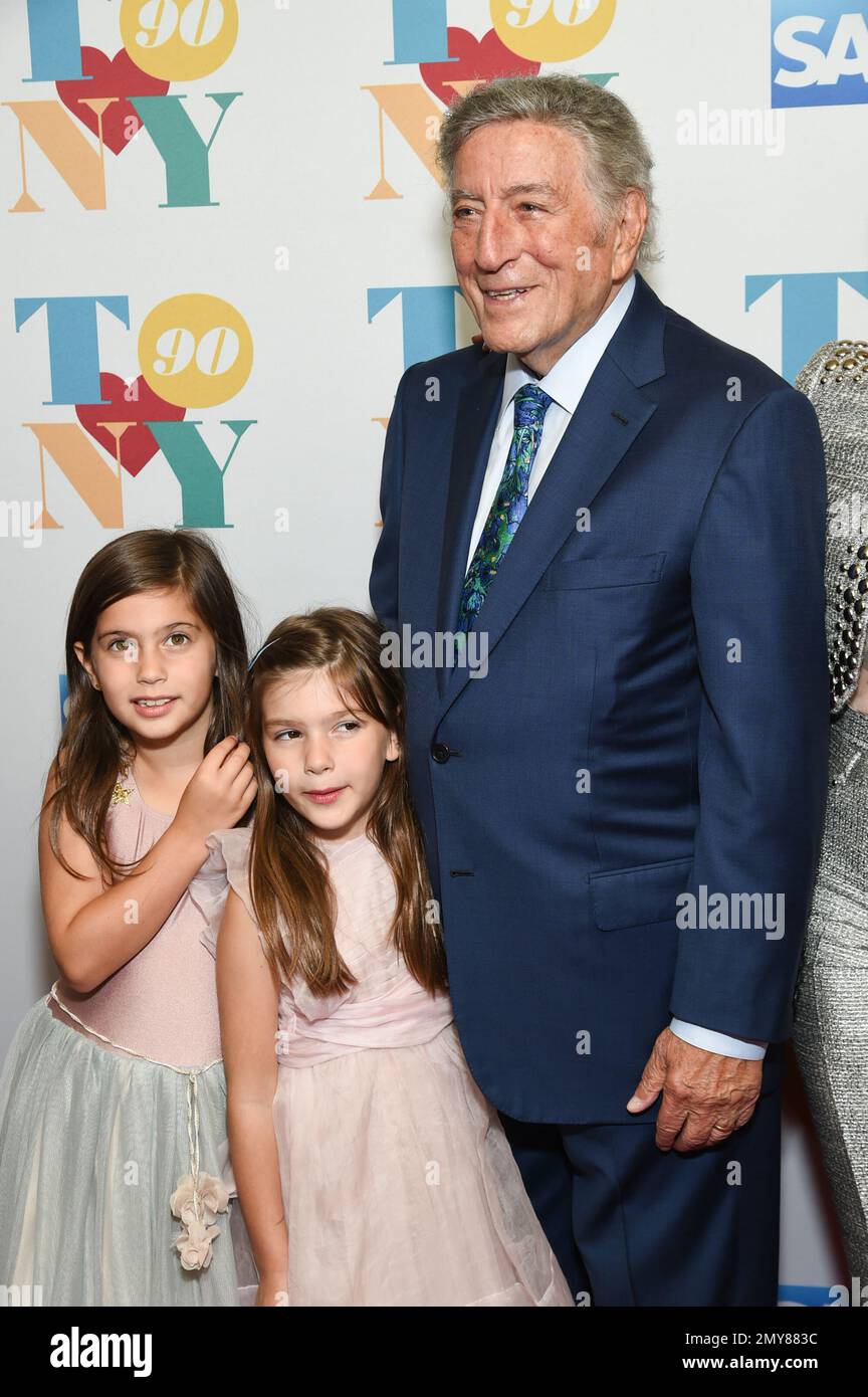 Singer Tony Bennett, right, poses with his grandchildren at his 90th ...