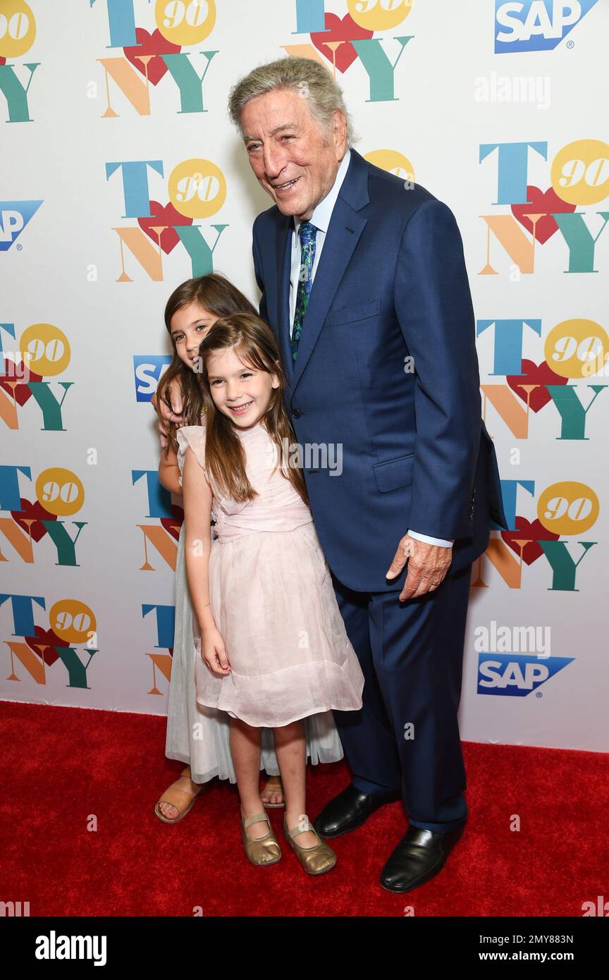 Singer Tony Bennett, right, poses with his grandchildren at his 90th ...