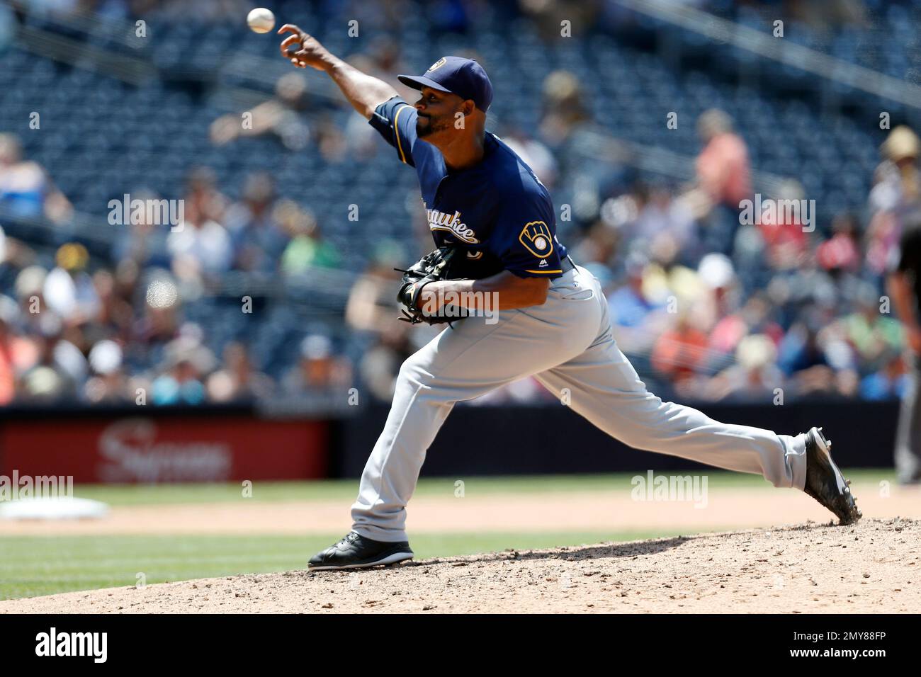 Milwaukee Brewers relief pitcher Jhan Marinez throws to the San Diego ...
