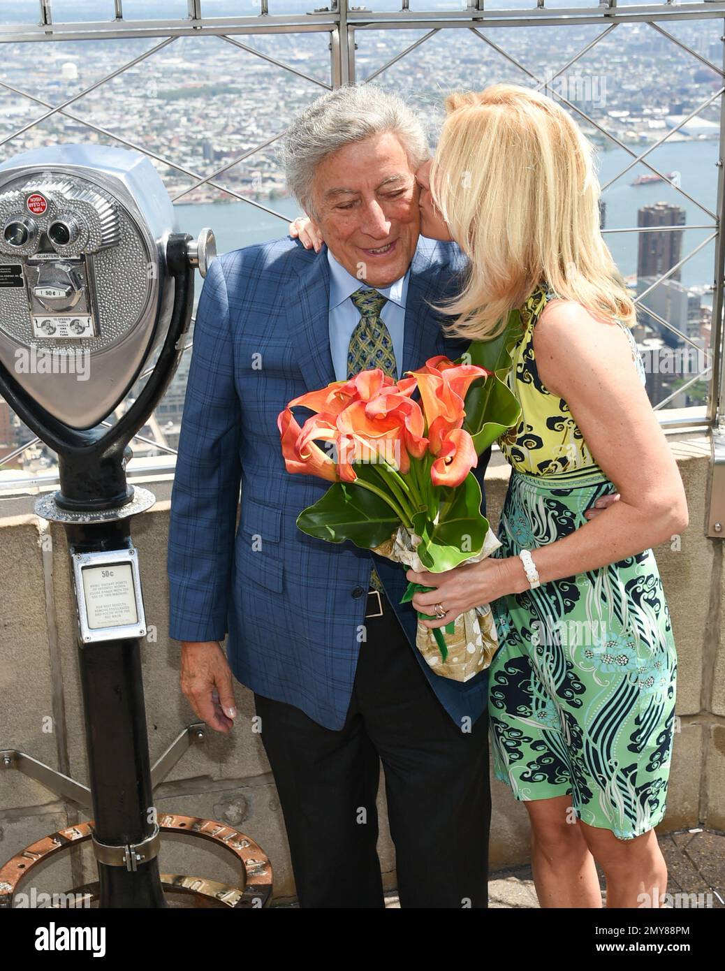 Singer Tony Bennett gets a kiss from his wife Susan Crow on the 86th ...