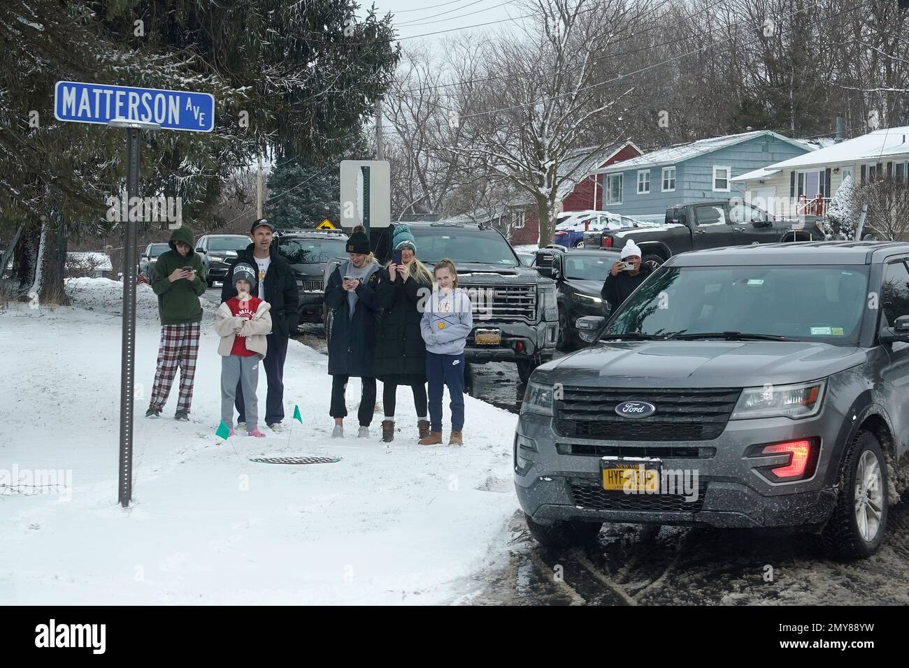 People watch as President Joe Biden's motorcade departs after visiting ...