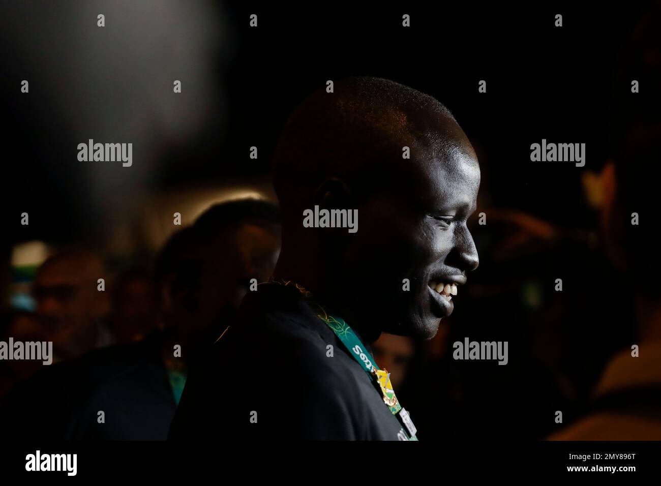 Refugee Olympic Team member Yiech Pur Biel smiles while talking to ...