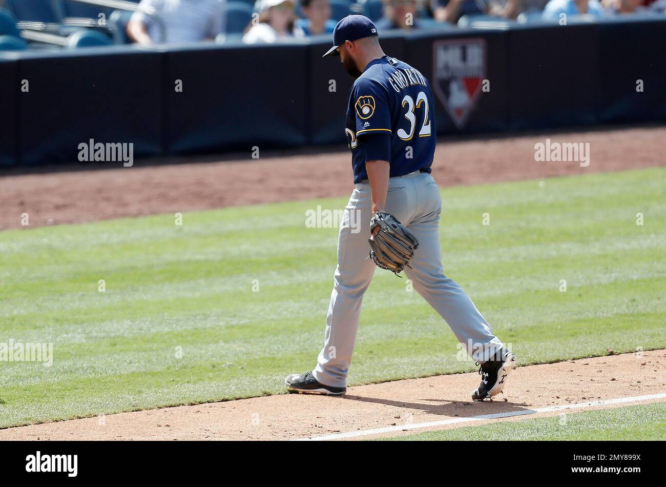 Milwaukee Brewers relief pitcher David Goforth walks to the dugout ...