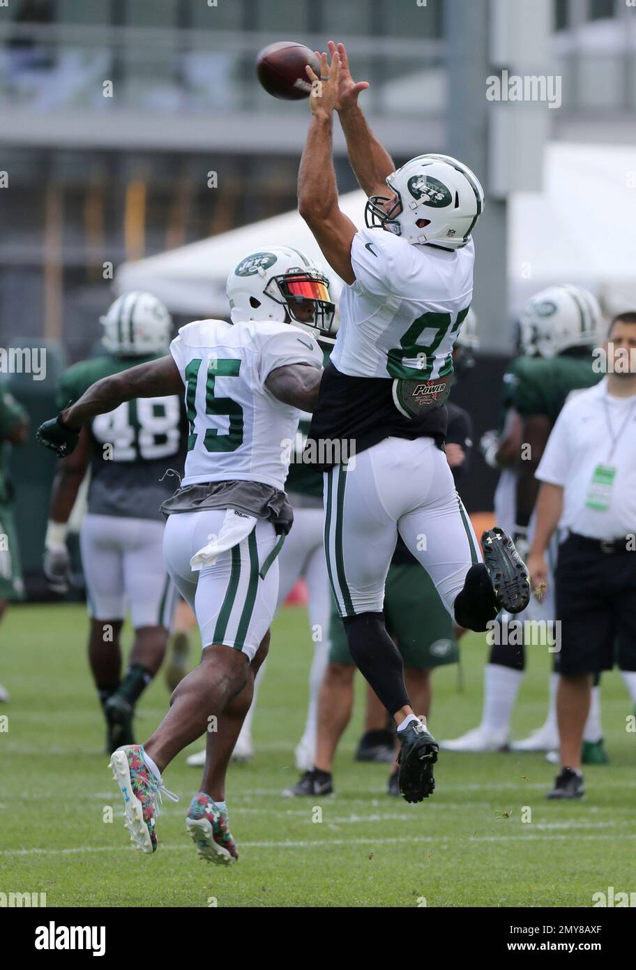 New York Jets' Eric Decker, right, makes a catch while Brandon Marshall ...