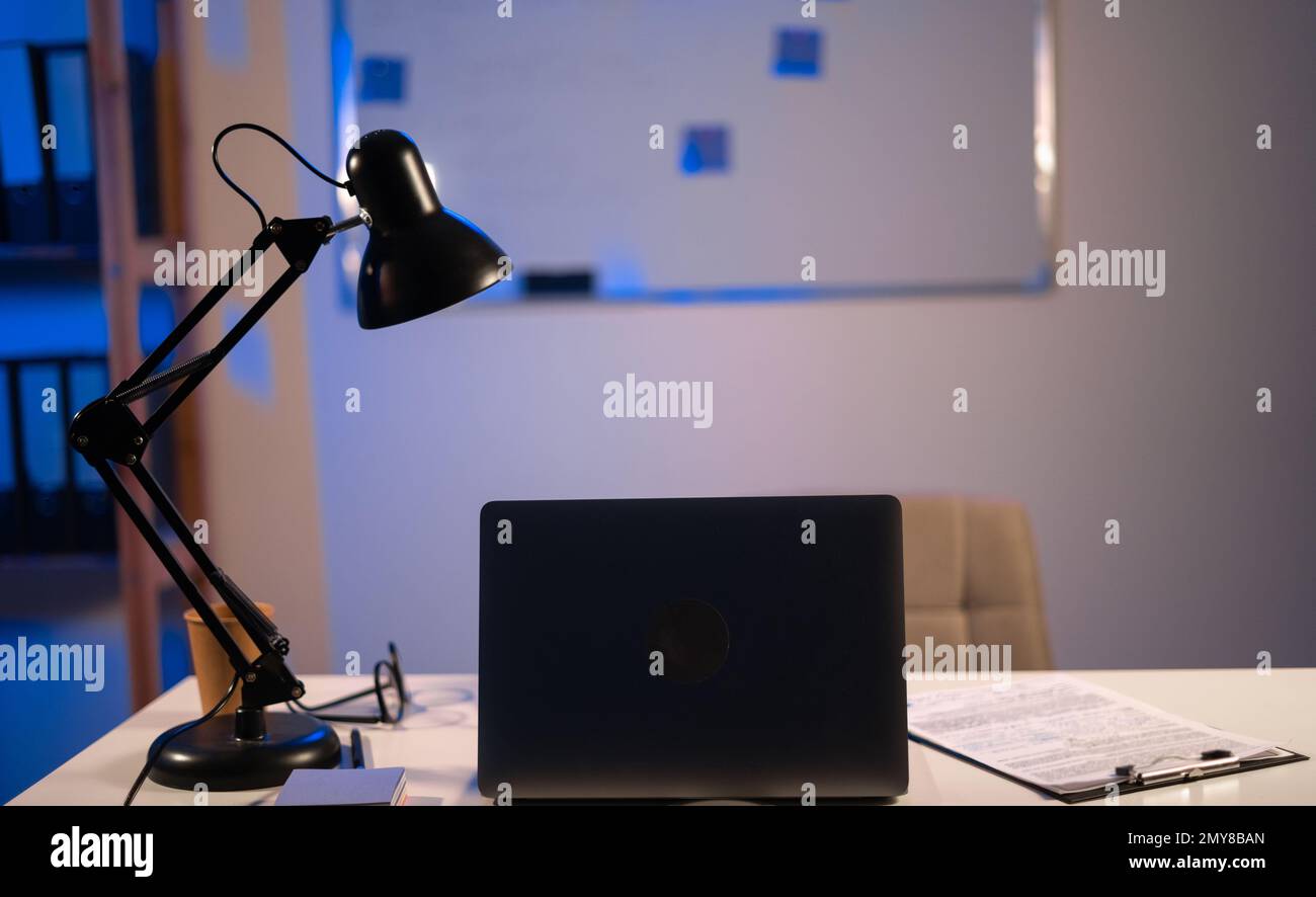 Interior of modern medical office. Doctor's workplace at night. Empty ...