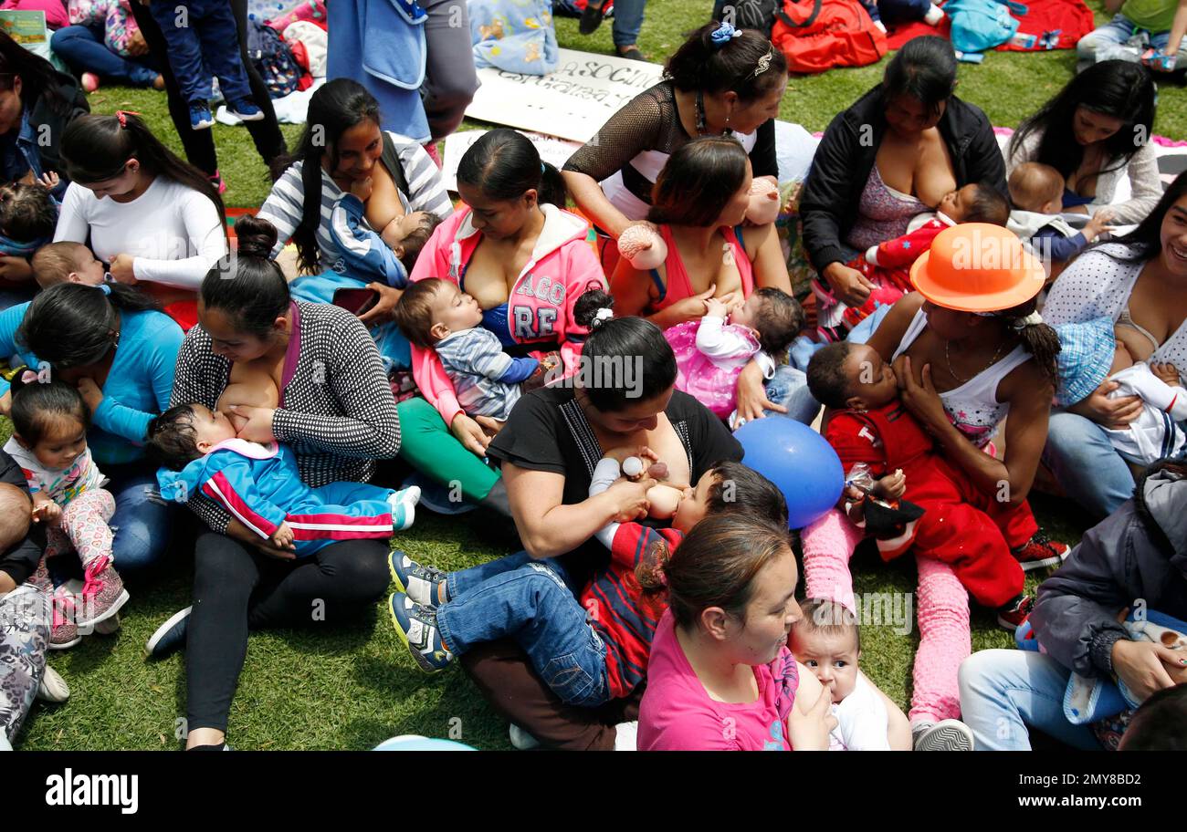 Mothers feed their babies during the event, "Breastfeeding is an act of ...