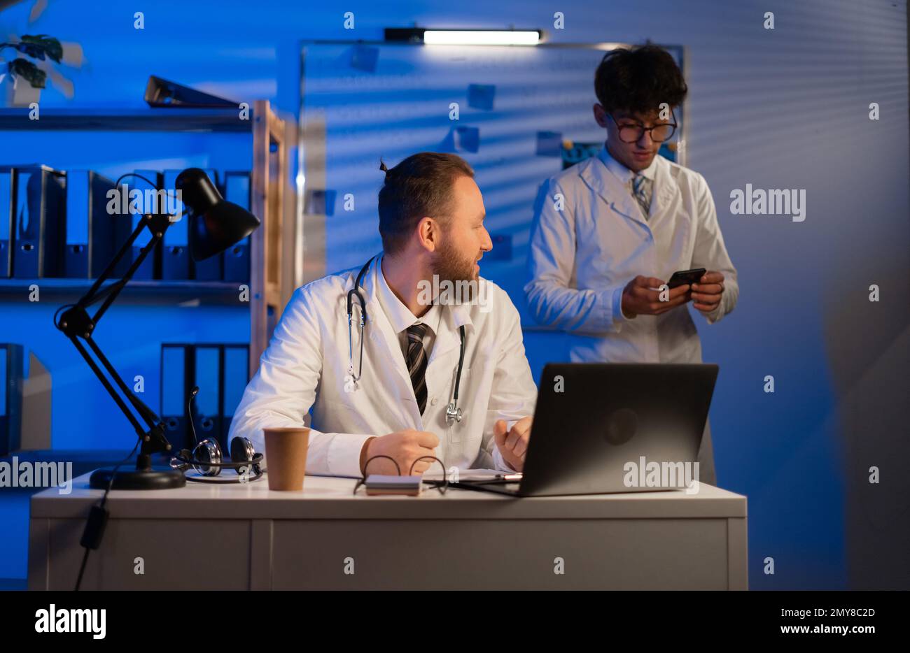 Doctors working night shift in hospital, colleagues therapists at ...
