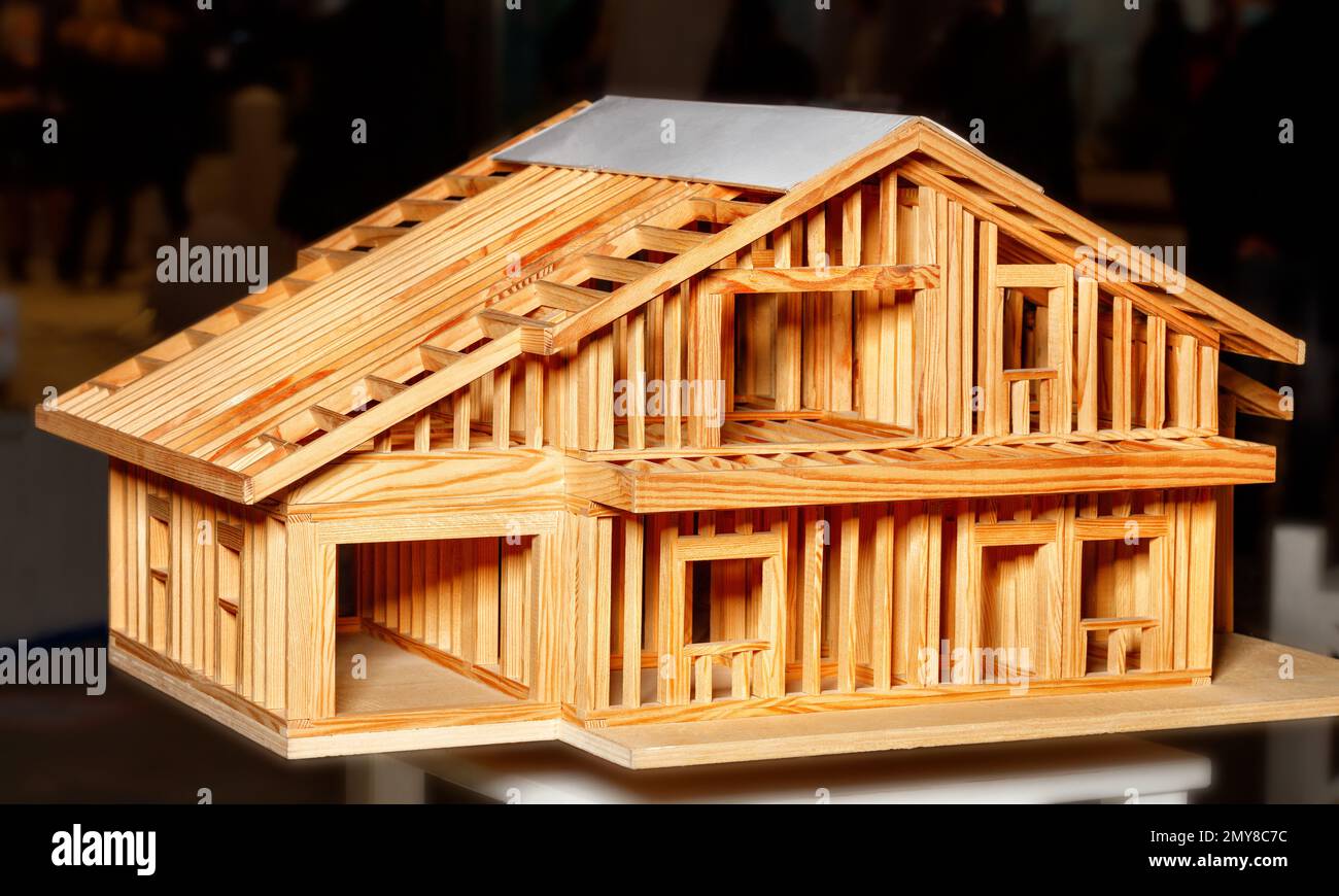 Wooden frame of a private house. Miniature model. Dark background Stock ...