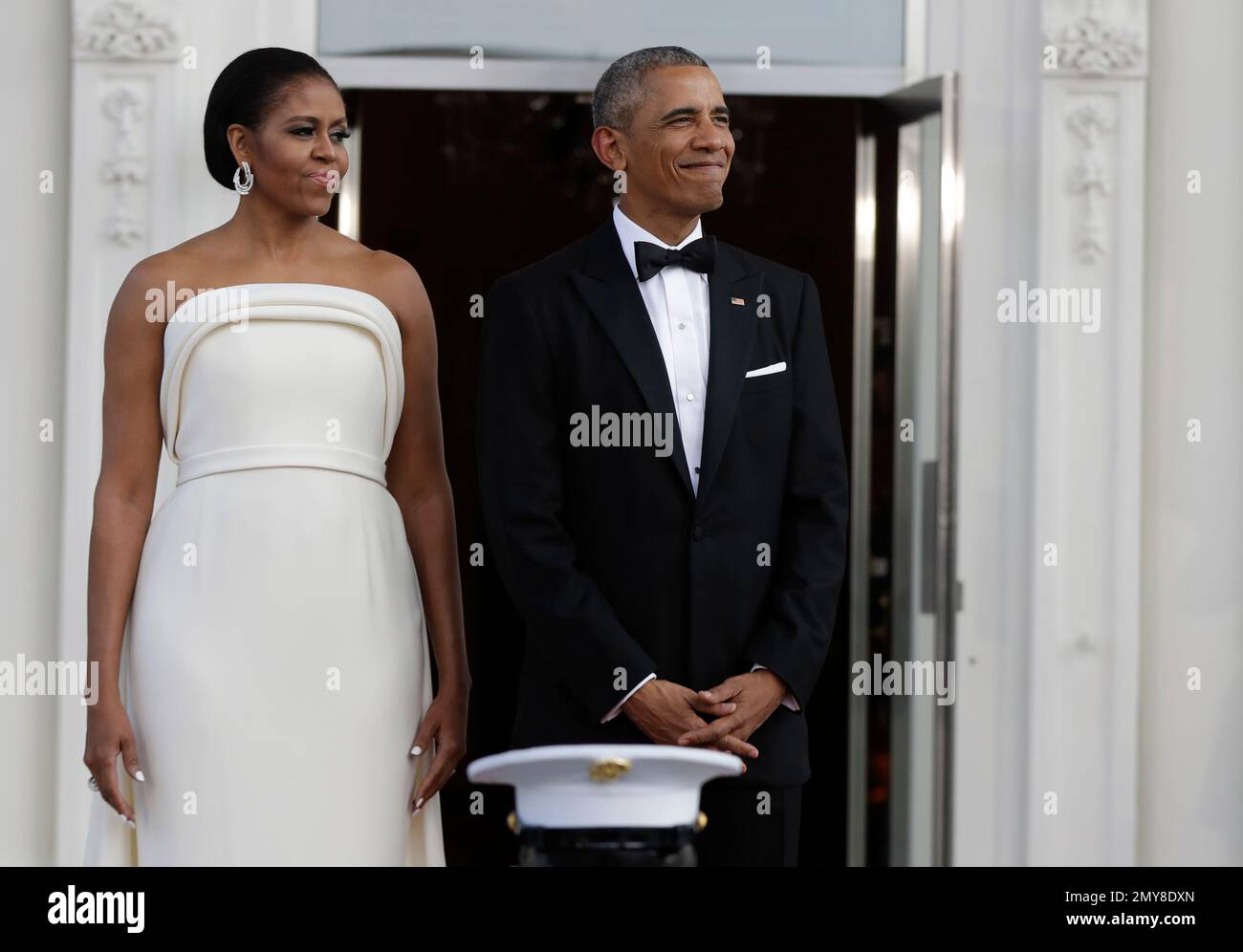 President Barack Obama and first lady Michelle Obama wait for the ...