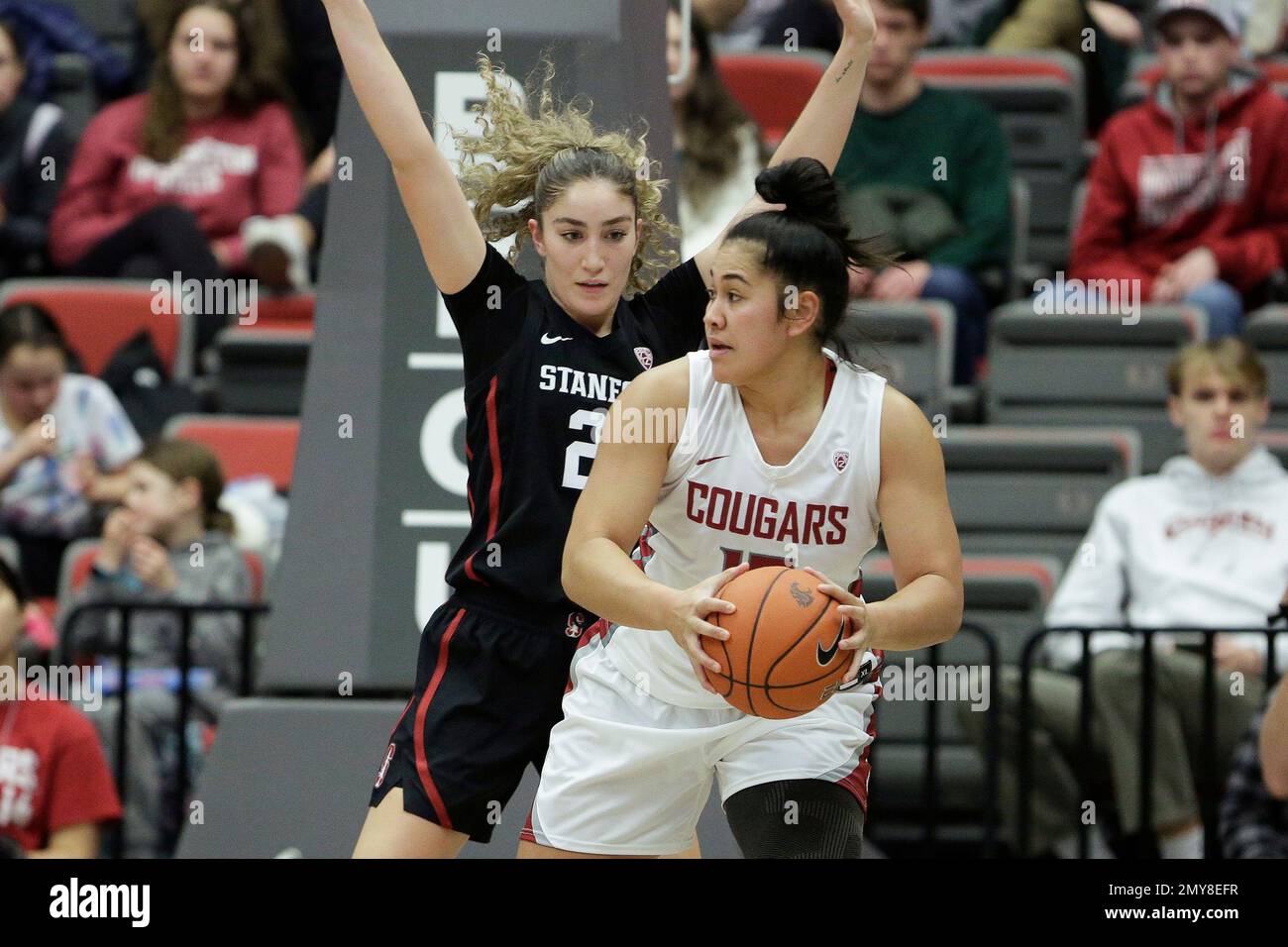 Washington State forward Ula Motuga, right, controls the ball while defended by Stanford forward ...